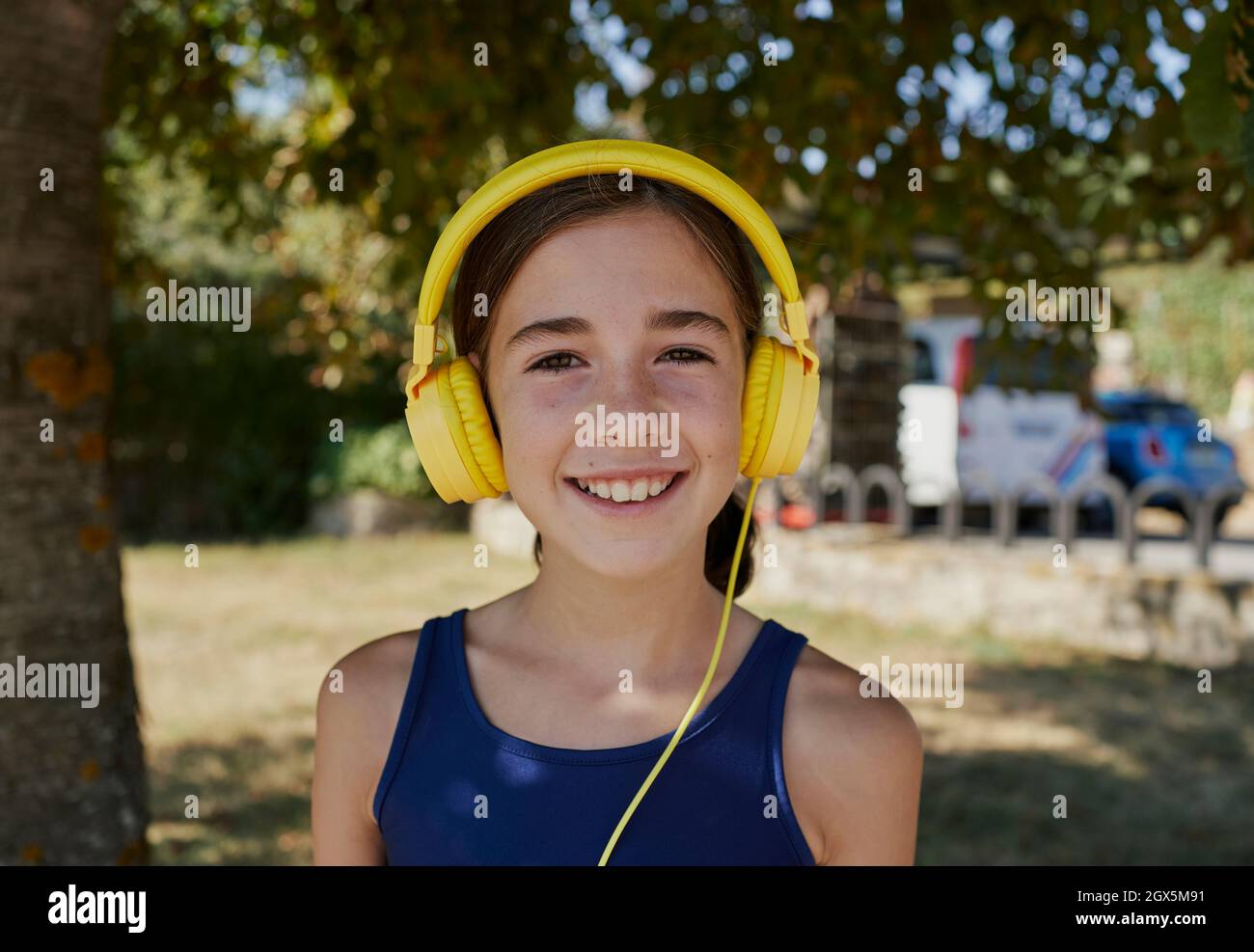 close-up of a beautiful Spanish girl who smiles and looks to the camera ...