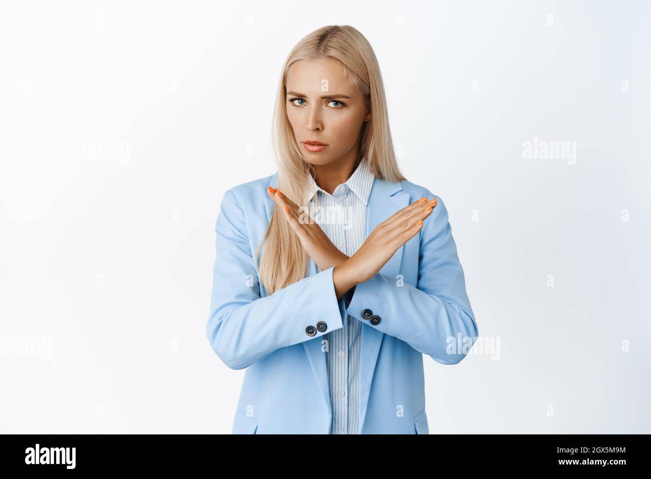 Serious business woman makes cross with arms, decline smth bad, reject ...