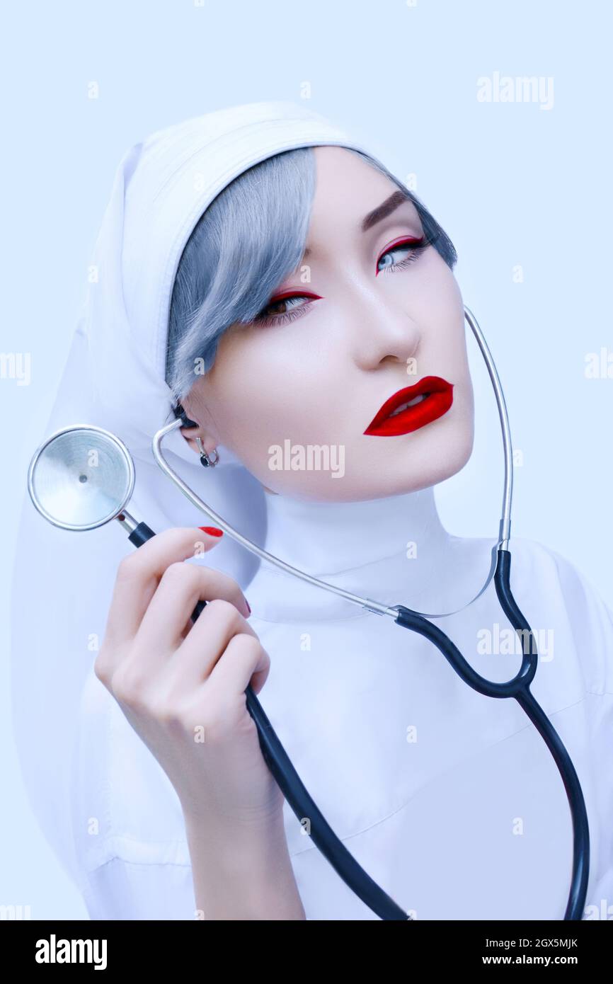 Gothic Nurse in white uniform Stock Photo - Alamy