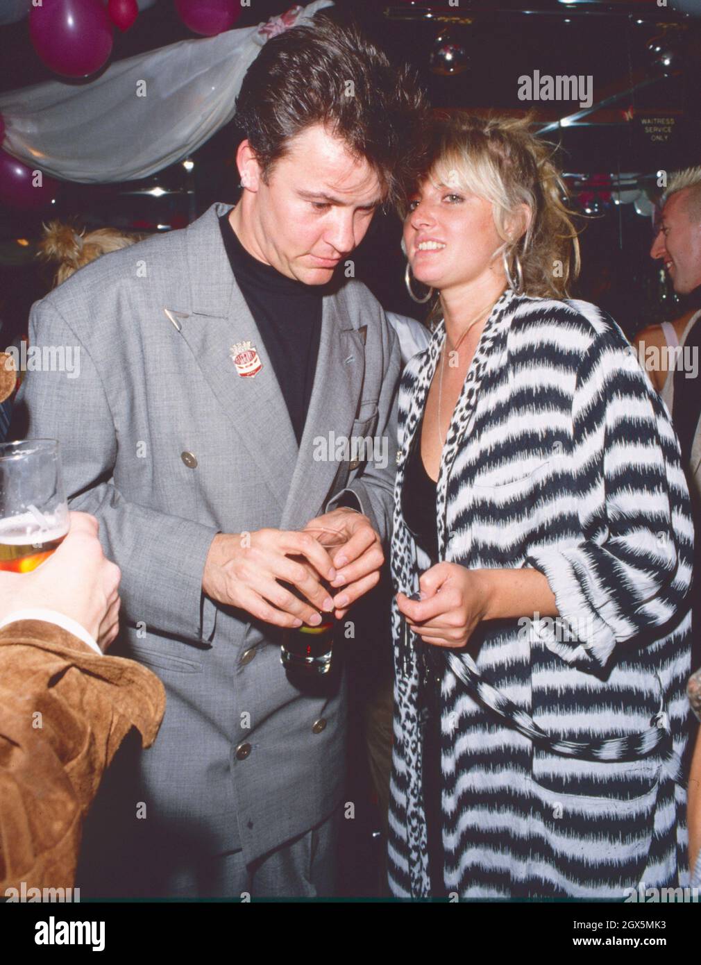 London, UK. LIBRARY. Singer Paul Young and Karen Stringfellow. . Party ...