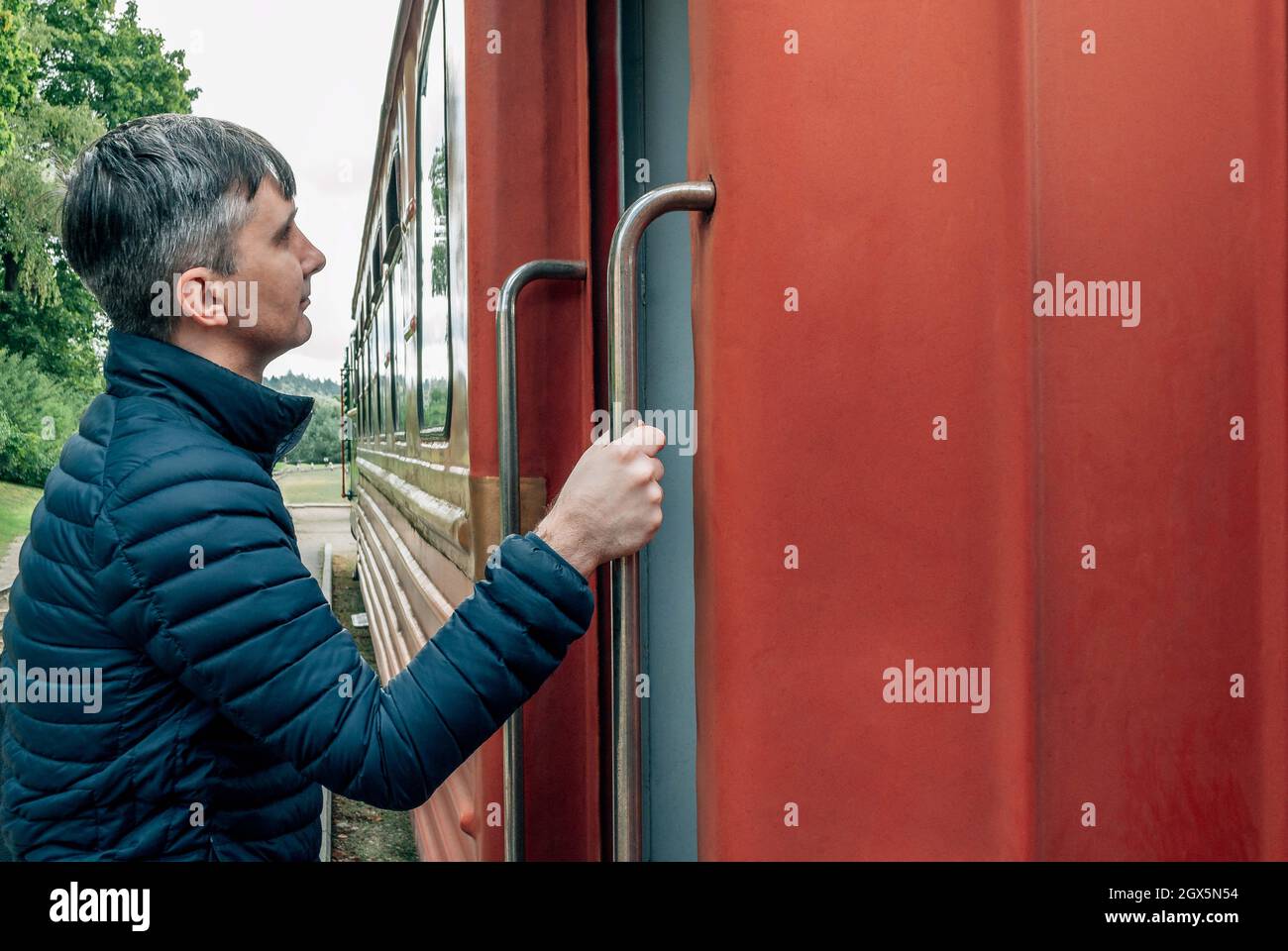 Man entering train hi-res stock photography and images - Alamy