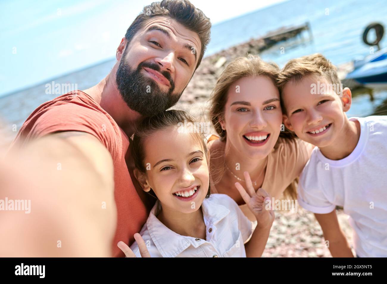 A picture of happy smiling family having fun on a beach Stock Photo - Alamy