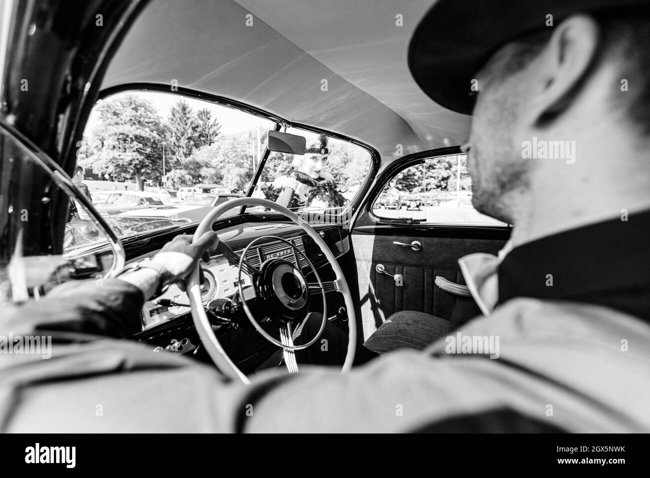 Two woman sitting car Black and White Stock Photos & Images - Alamy