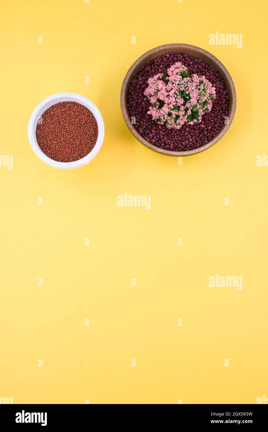 decorative orange colored sand in a wooden and white vase Stock Photo ...