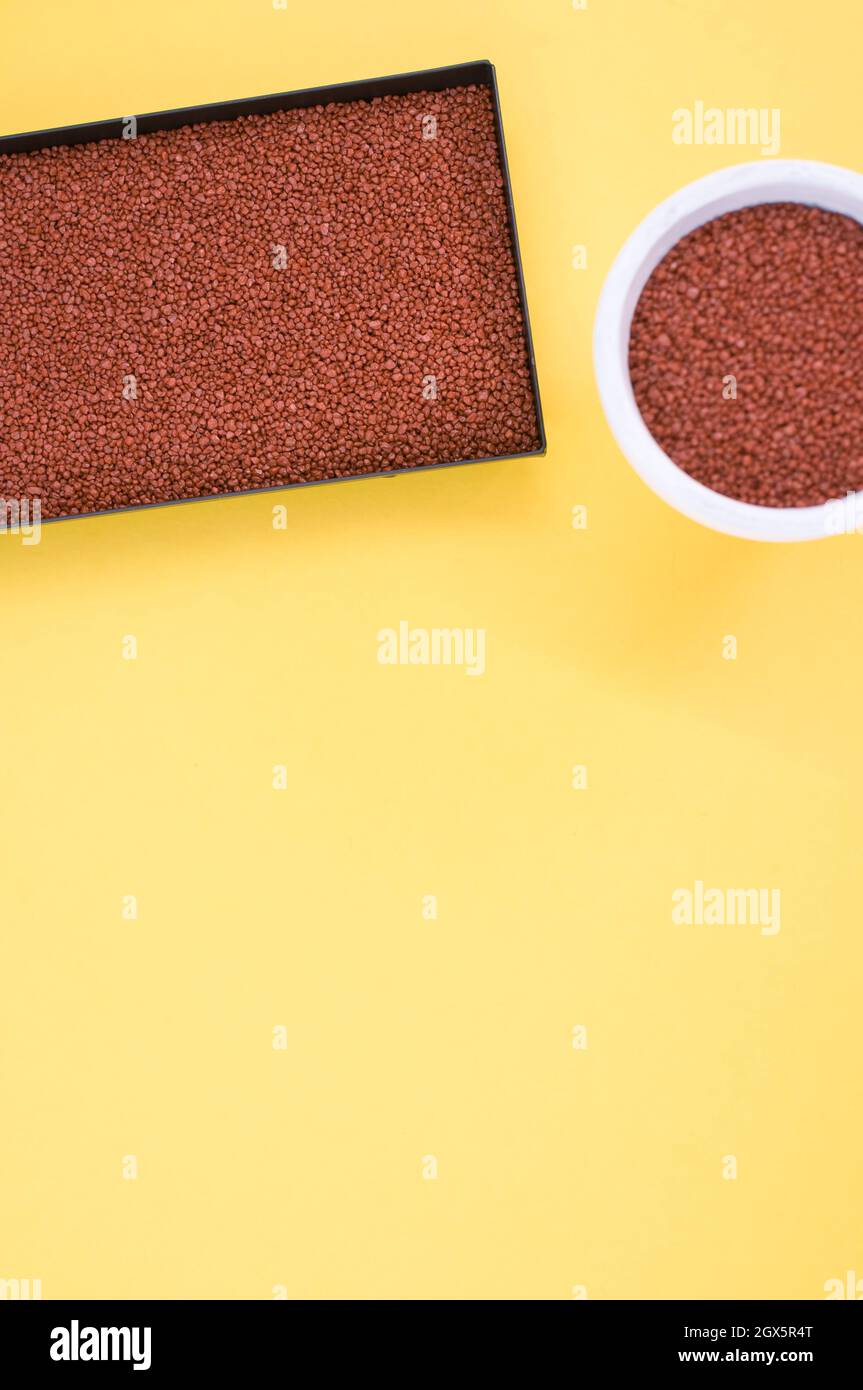 decorative orange colored sand in a metal box and white vase Stock ...