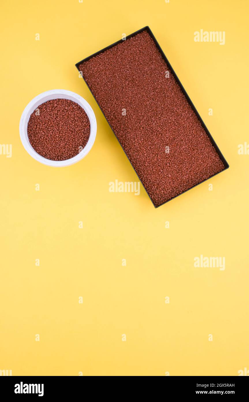 decorative orange colored sand in a metal box and white vase Stock ...
