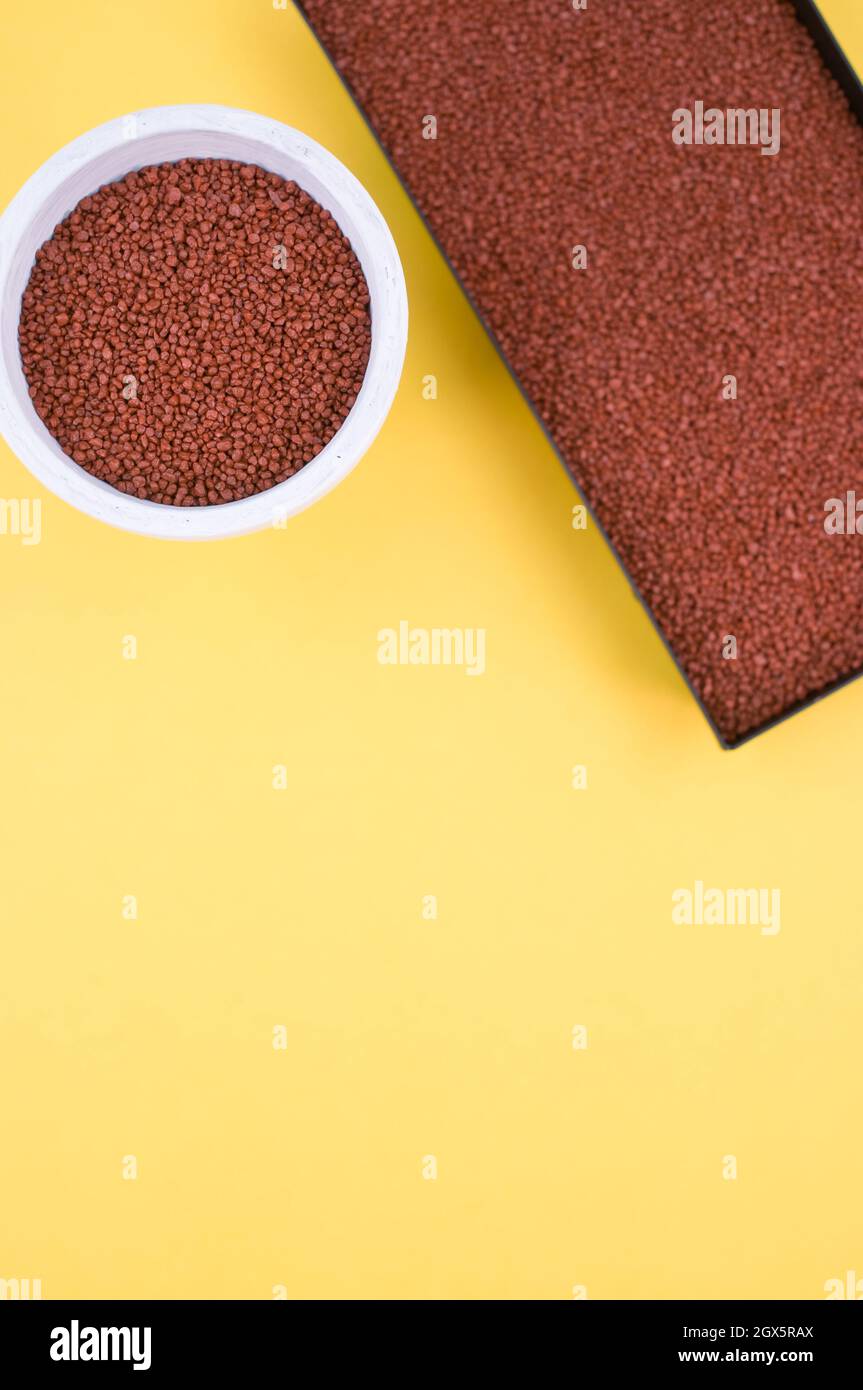 decorative orange colored sand in a metal box and white vase Stock ...