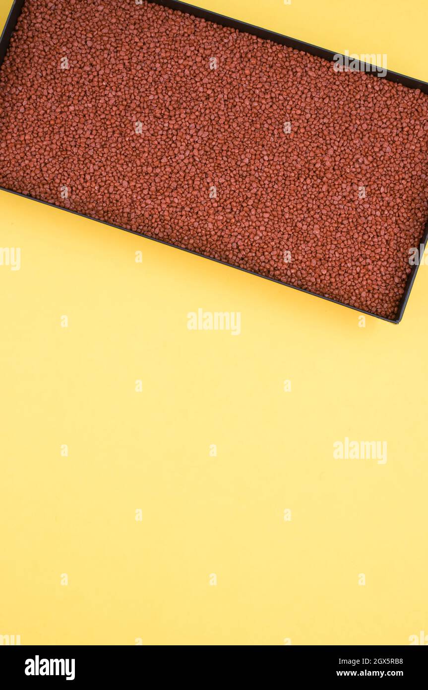 decorative orange colored sand in a metal box and white vase Stock ...