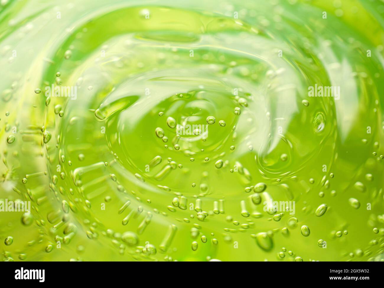 Cosmetic gel background. Green transparent gel with texture and bubbles ...