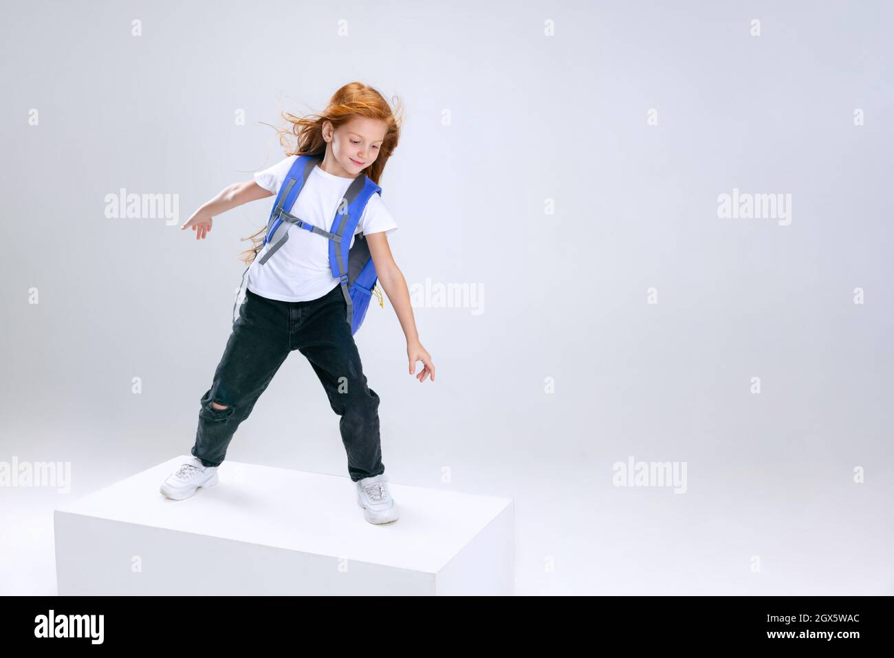 Portrait of little Caucasian girl, child posing isolated over white ...