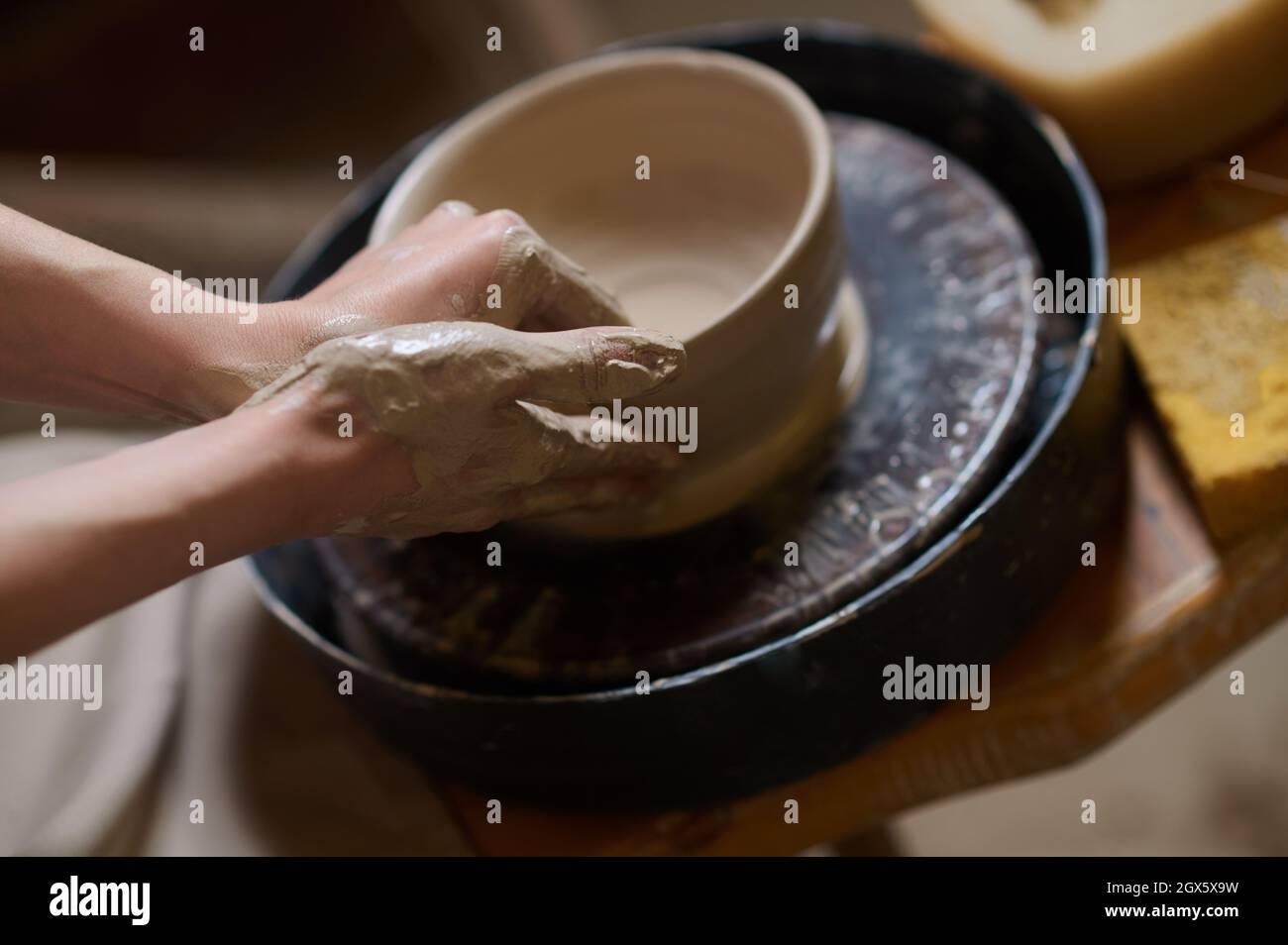 Close up of human hands making a bowl on a pottery wheel Stock Photo ...