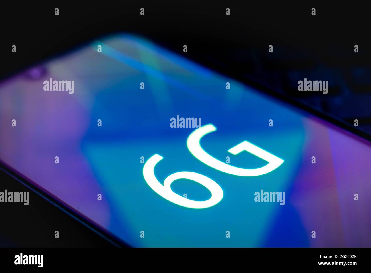 In this photo illustration, a 6G logo seen displayed on a smartphone ...
