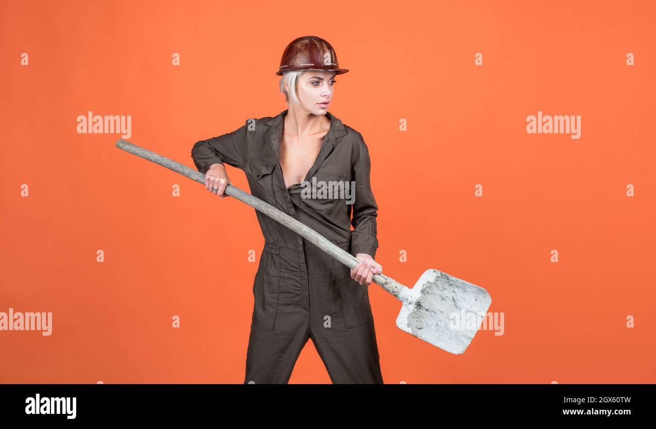 foreman girl wear safety hardhat. labor day. woman in boilersuit and ...