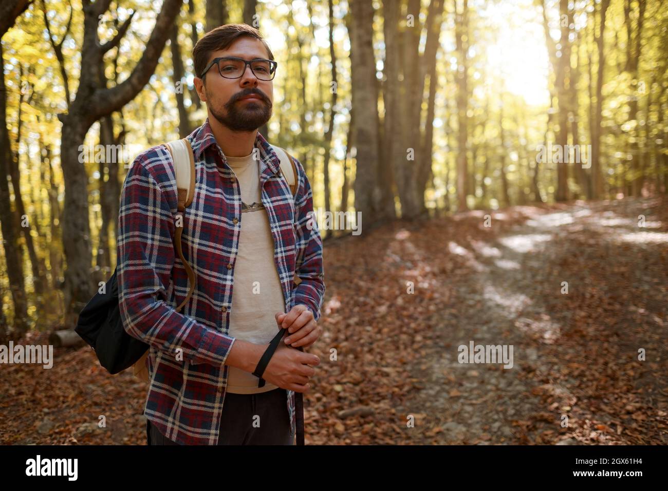 Caucasian hipster male model outdoors in nature. Colorful landscape ...