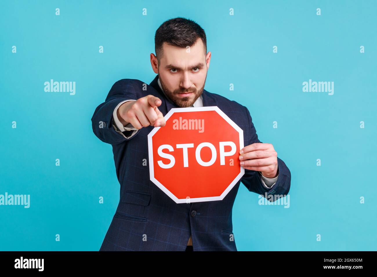 Hey you, access forbidden. Strict bossy man wearing dark official style ...