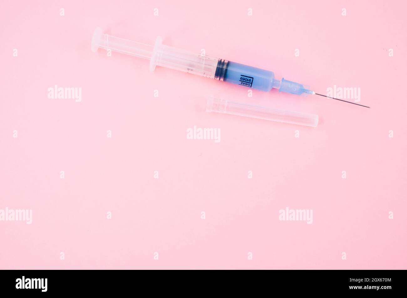 isolated sterilized injection syringe on a pink background Stock Photo ...