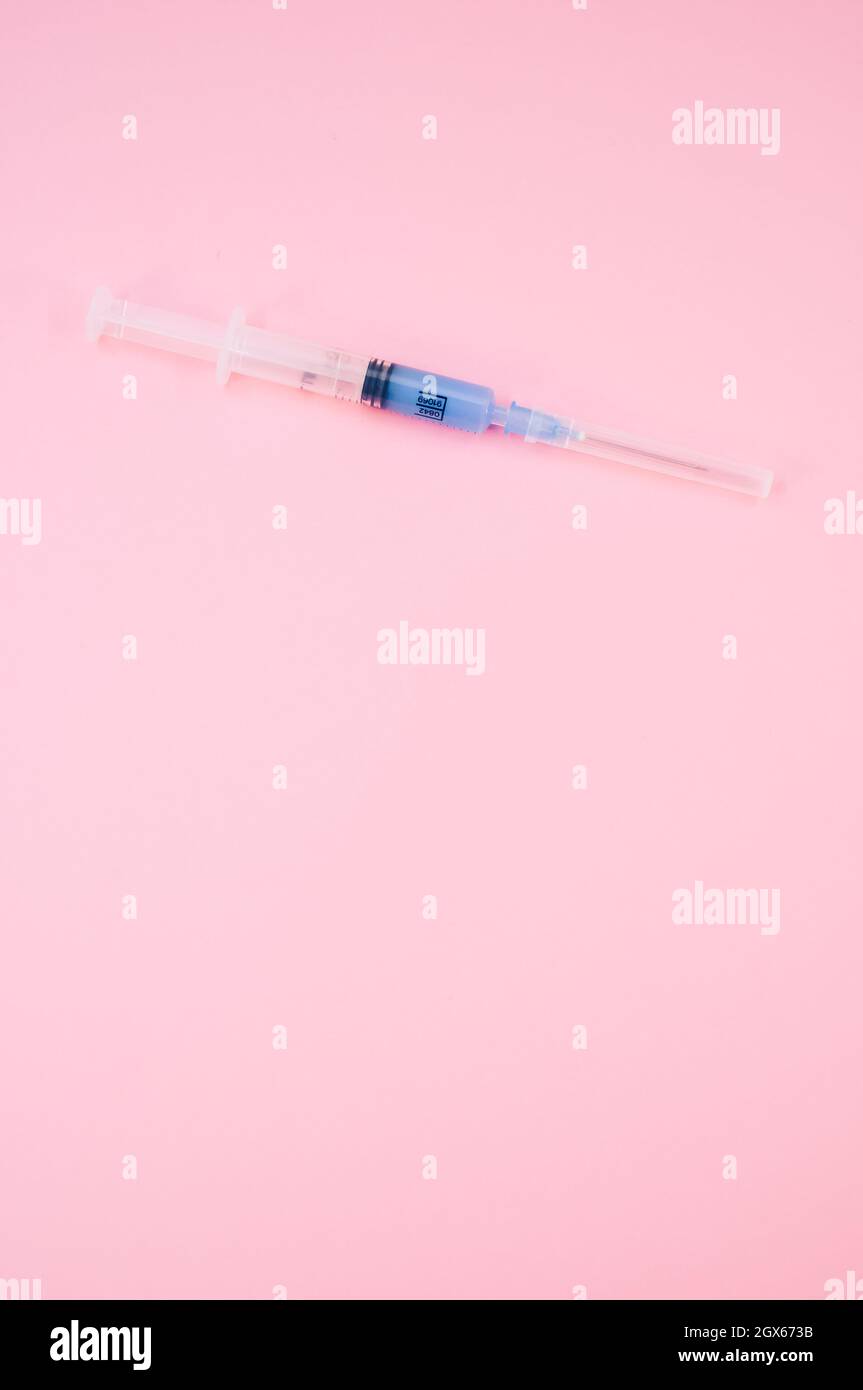 isolated sterilized injection syringe on a pink background Stock Photo ...