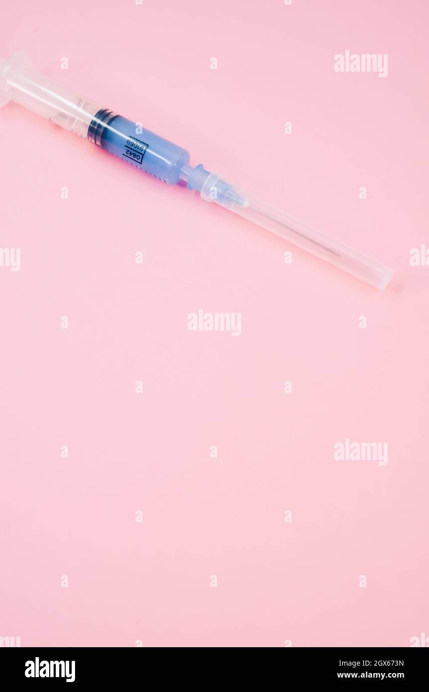 isolated sterilized injection syringe on a pink background Stock Photo ...