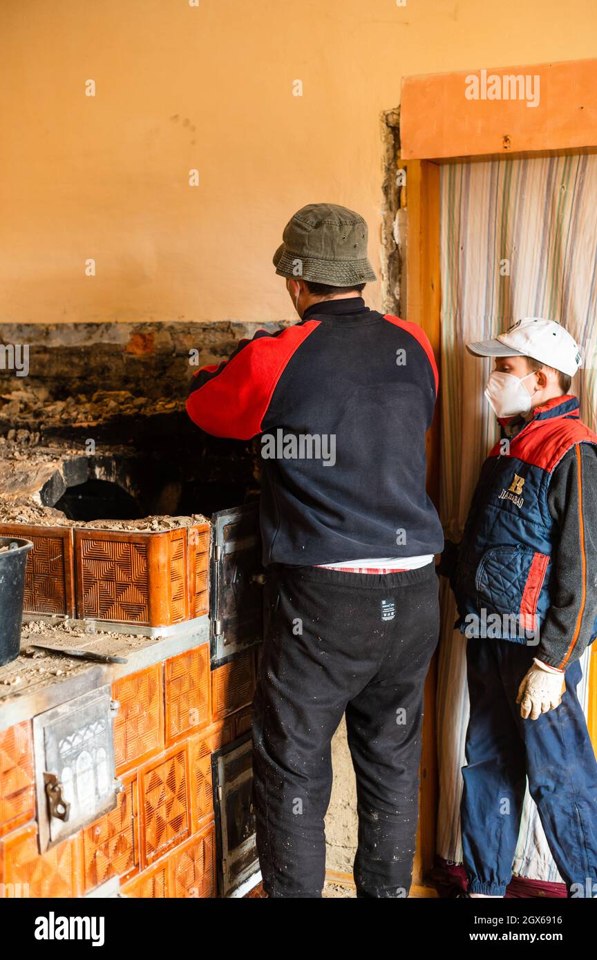 Dismantling an old oven with a built-in kitchen surface for cooking ...