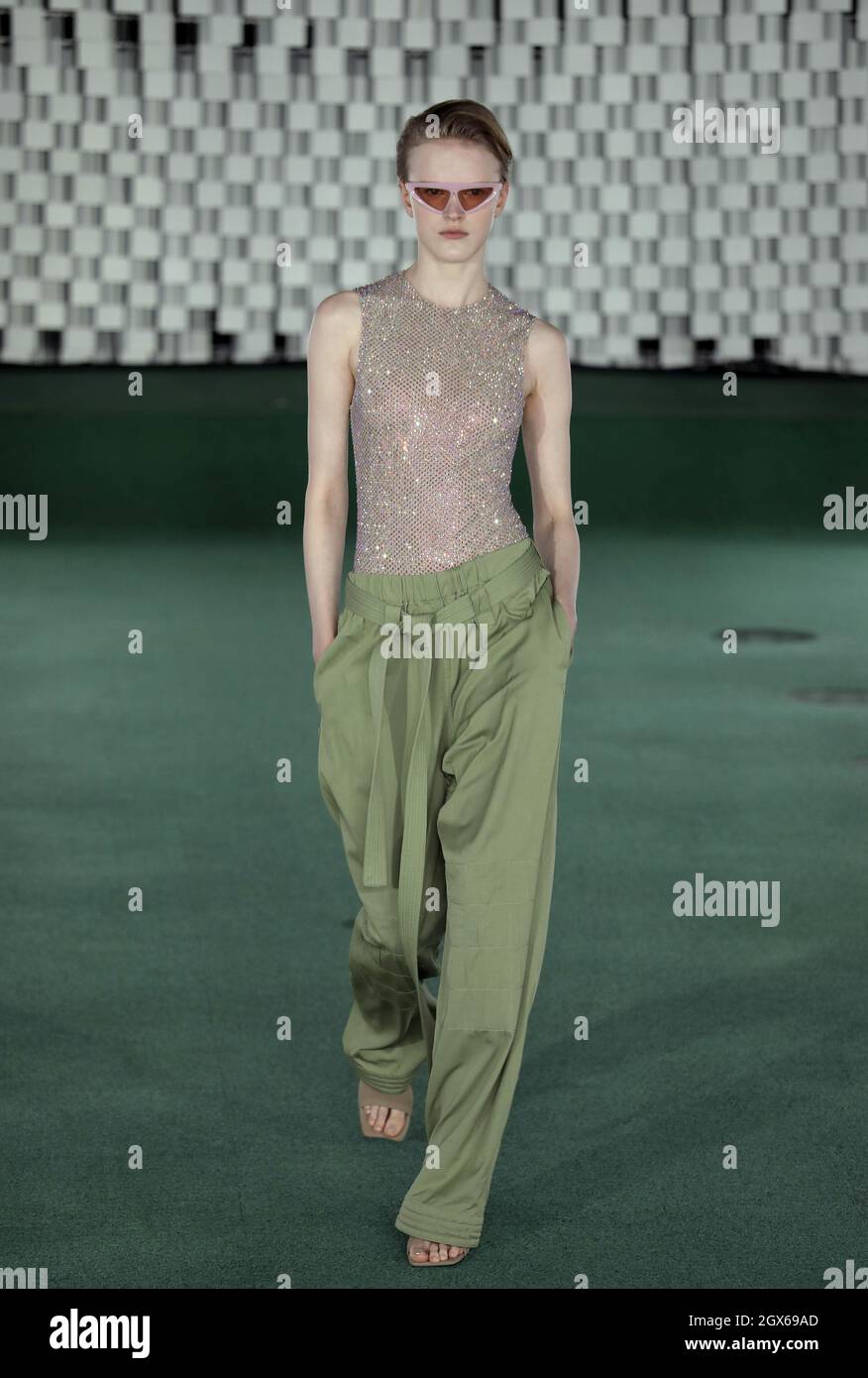 Paris, France. 04th Oct, 2021. A model takes to the catwalk during ...