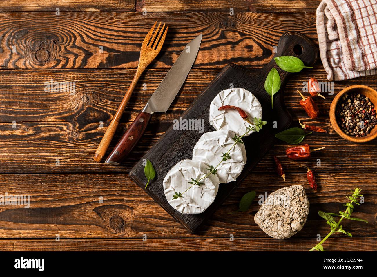 Camembert cheese on a rustic background. Noble cheese with mold. An ...