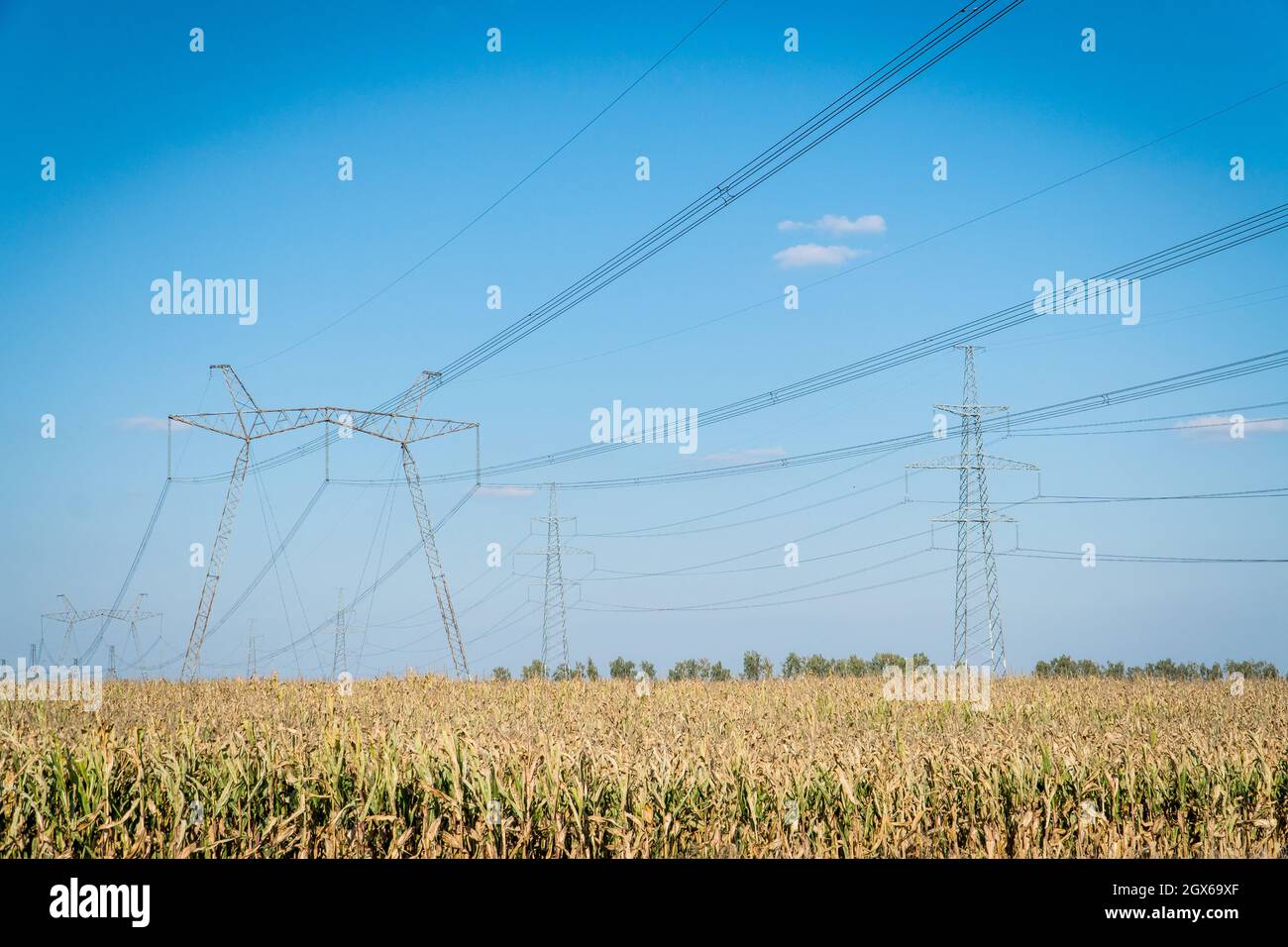High voltage power lines. Modern electric energy industry Stock Photo ...
