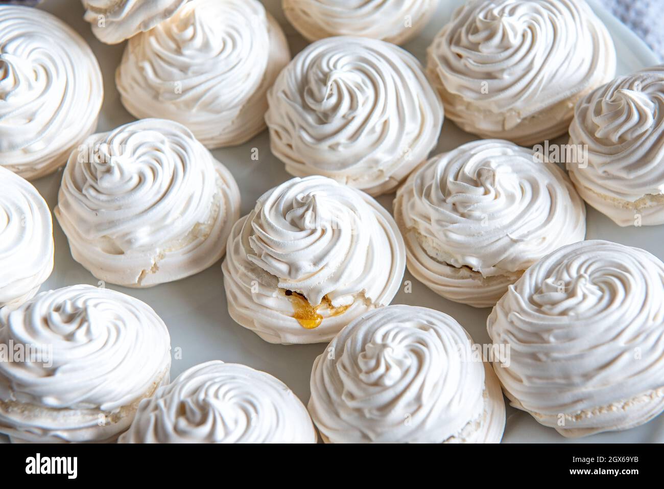 Pattern of baked meringue kisses Stock Photo - Alamy