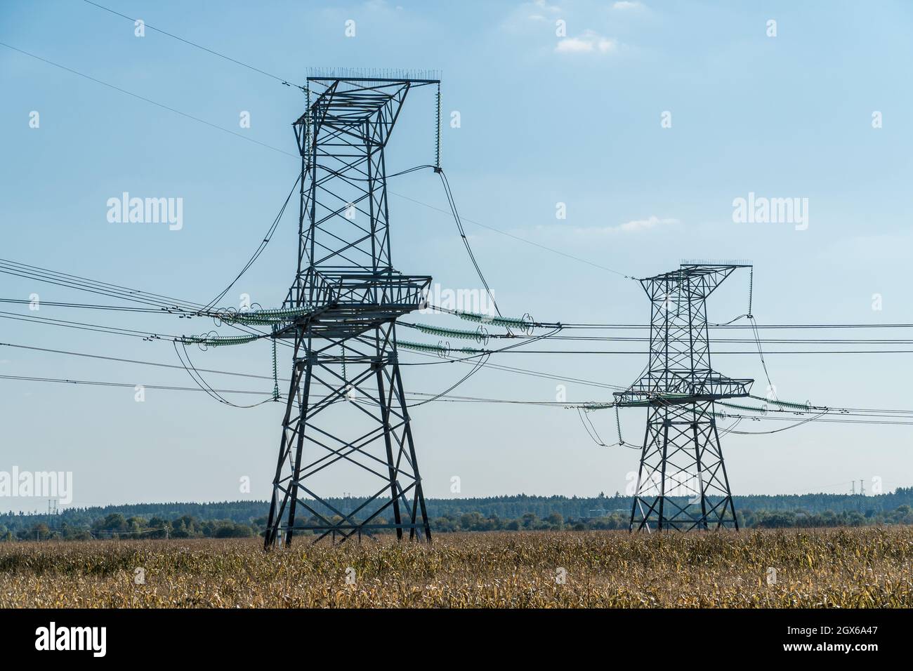 High voltage power lines. Modern electric energy industry Stock Photo ...