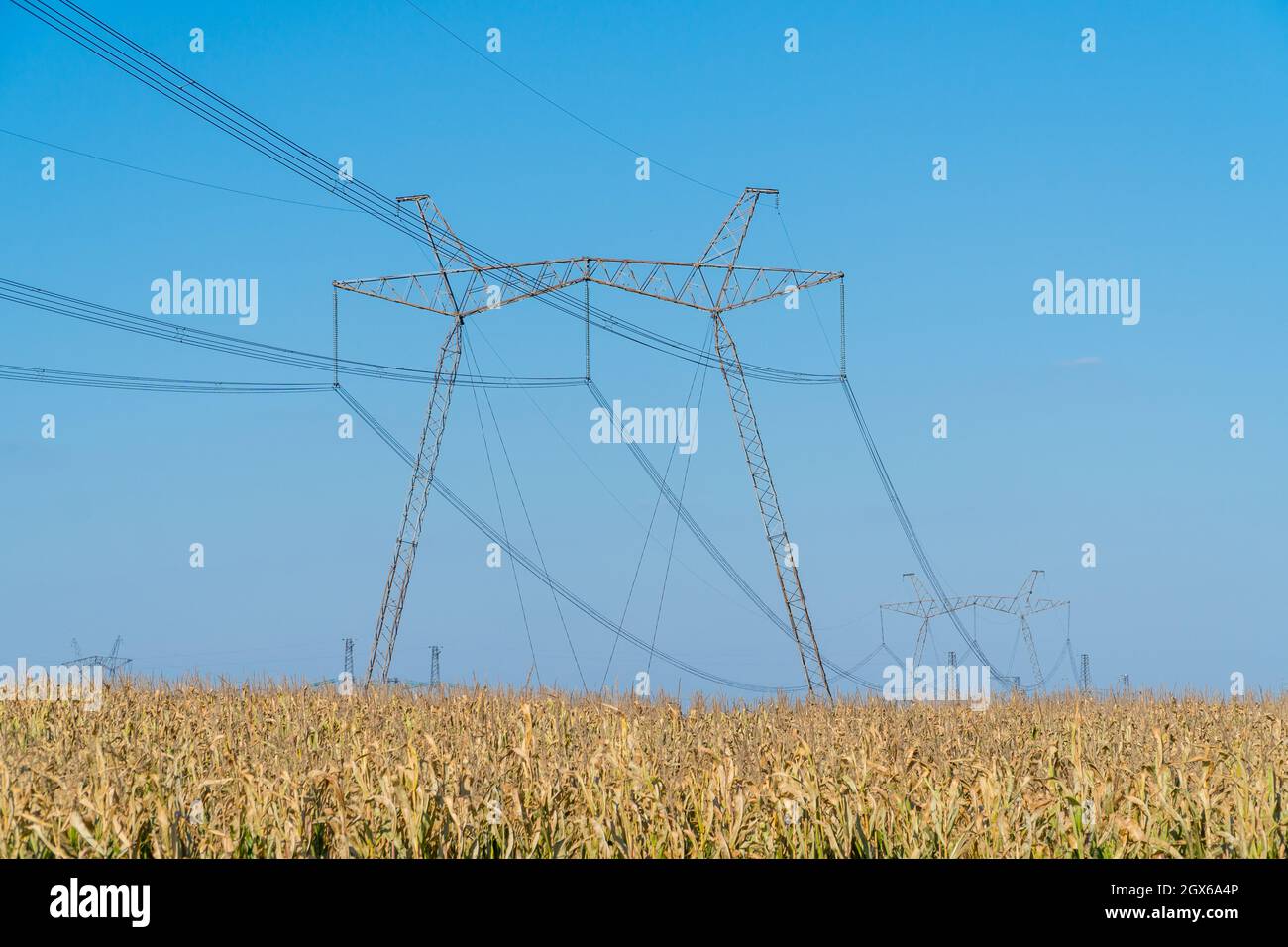 High voltage power lines. Modern electric energy industry Stock Photo ...