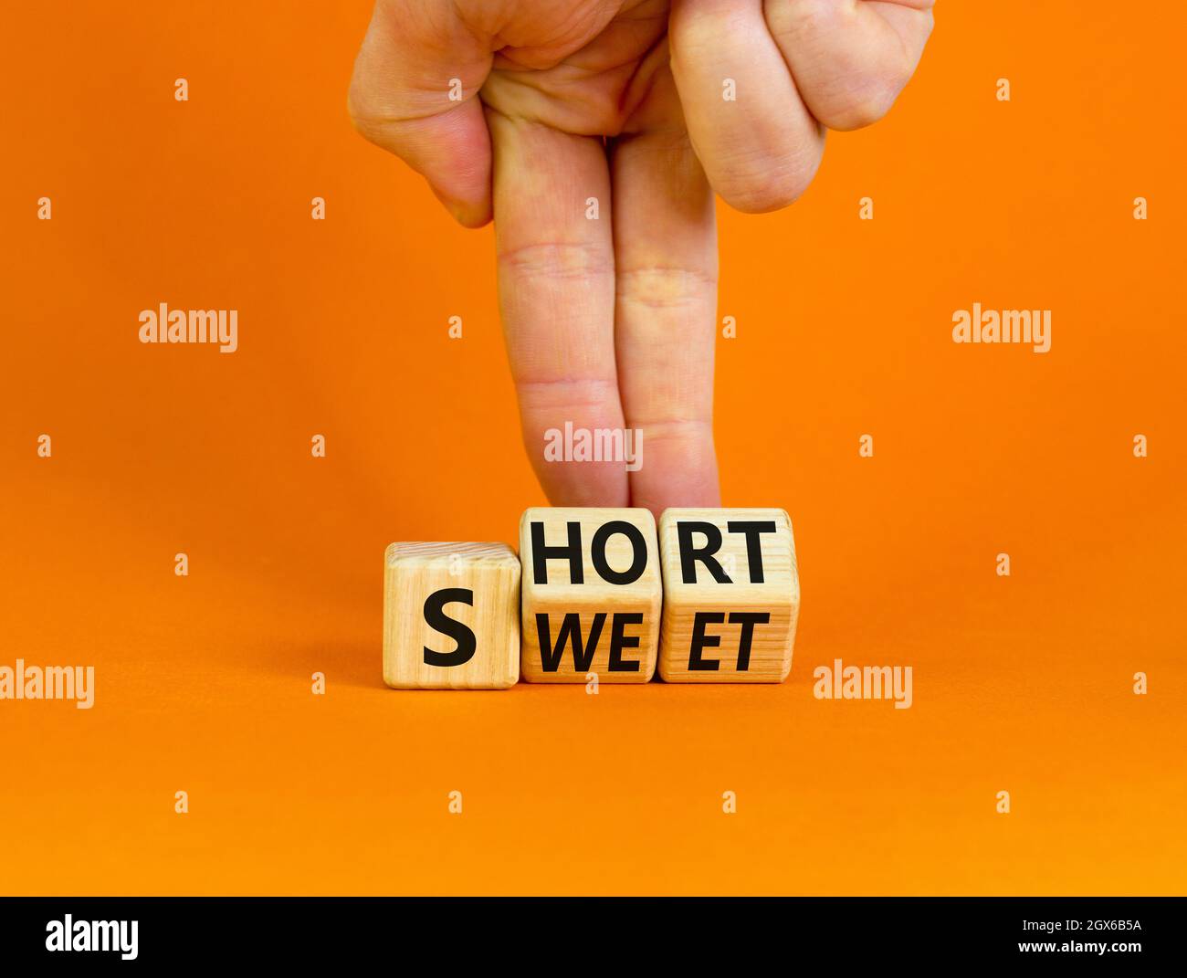 Short and sweet symbol. Businessman turns wooden cubes and changes the ...