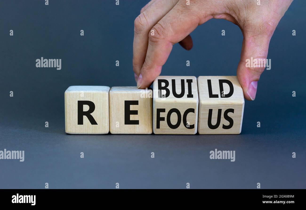 Refocus and rebuild symbol. Businessman turns cubes and changes the ...