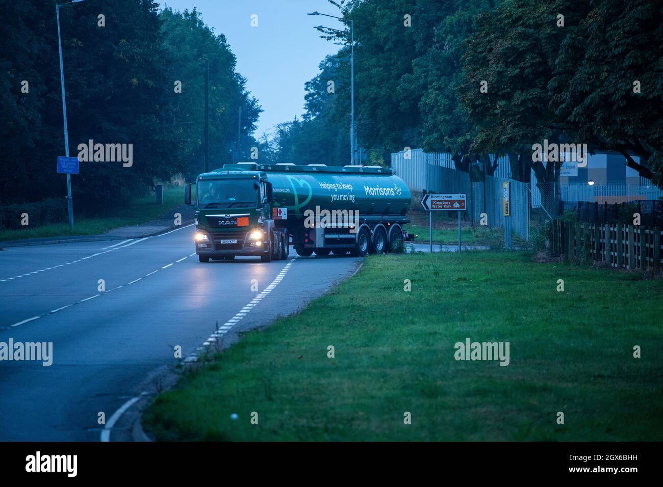 A Morrisons fuel tanker leaving the Kingsbury fuel depot as dawn breaks ...