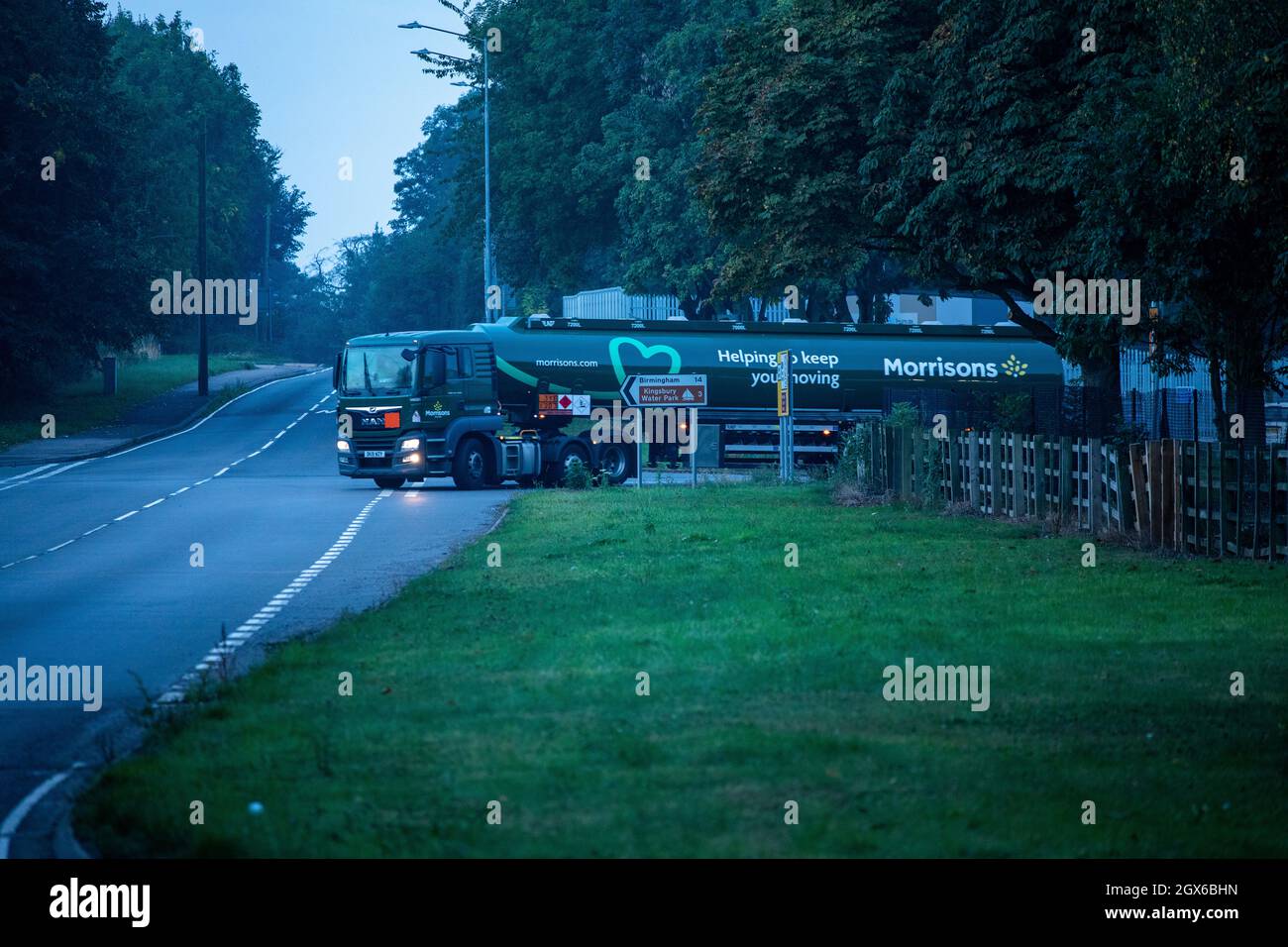 A Morrisons fuel tanker leaving the Kingsbury fuel depot as dawn breaks ...
