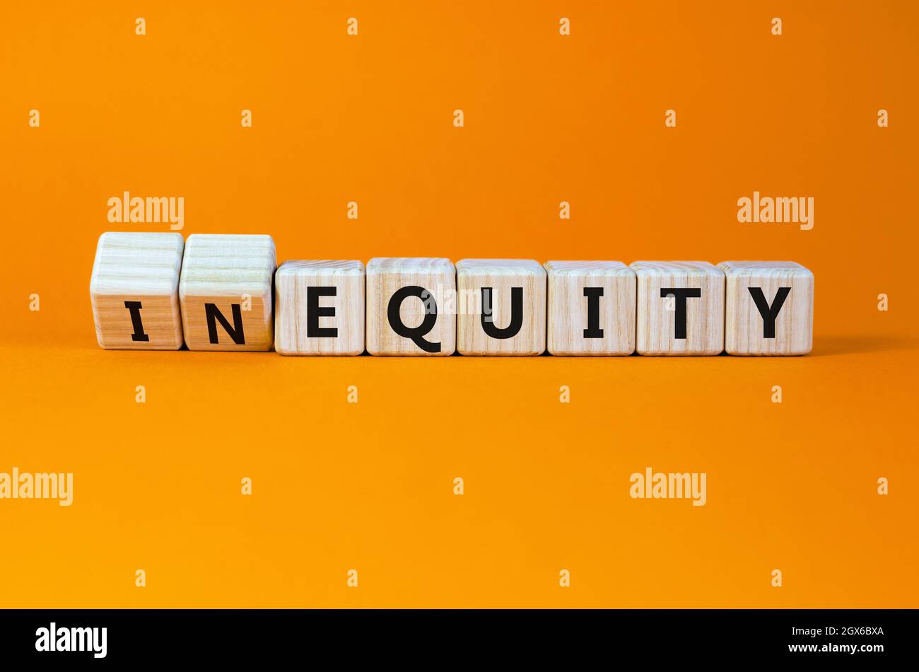 Inequity or equity symbol. Turned wooden cubes and changed the word ...