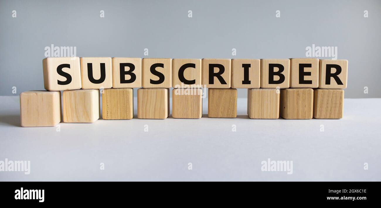 Subscriber symbol. The word Subscriber on wooden cubes. Beautiful white ...