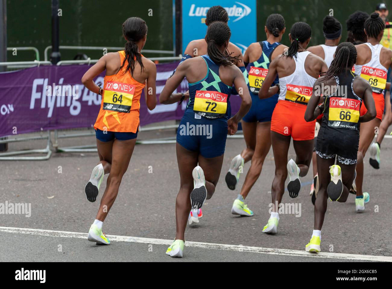 Rear of elite women racing in the Virgin Money London Marathon 2021, in ...
