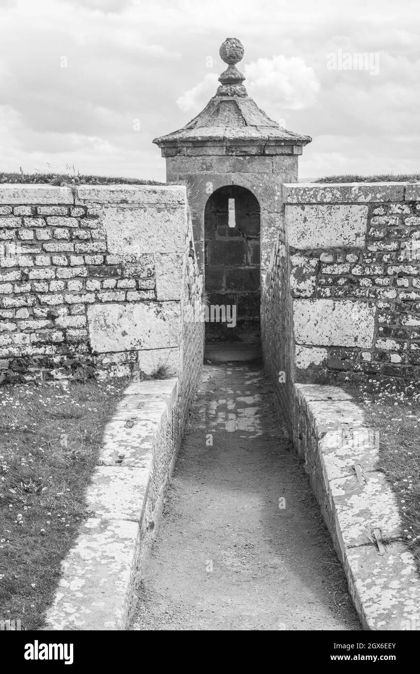 Vertical grayscale shot of the famous historic Fort George military ...
