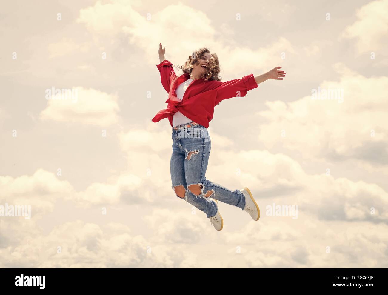 happy childhood. smiling child jumping so high. carefree and joyful ...