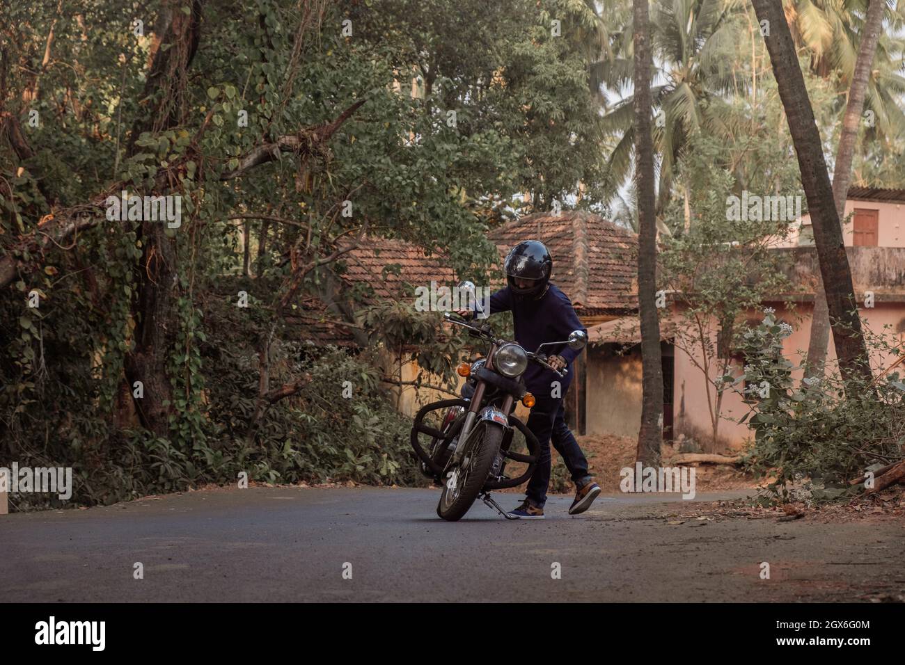 A Man On Motorcycle On Road in GOA village Stock Photo - Alamy
