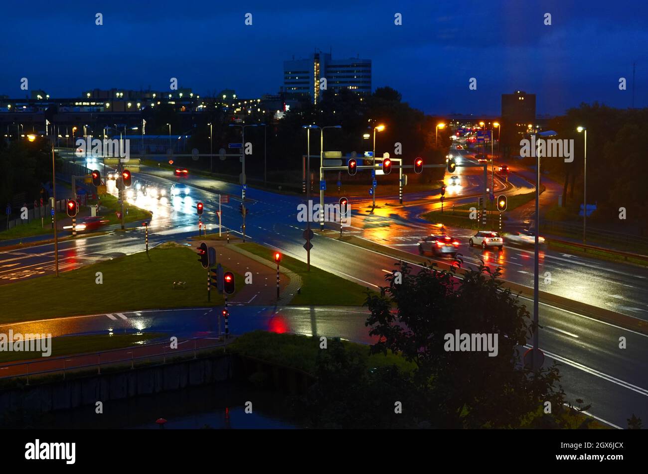 An intersection in the Netherlands with traffic lights and cars at ...