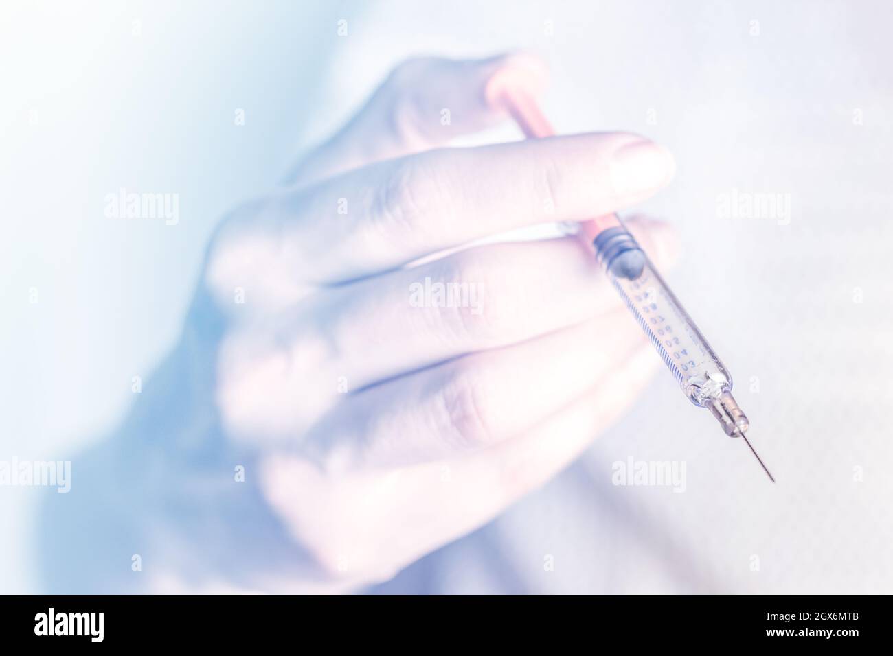 Syringe in hand, making injectionin process, close-up Stock Photo - Alamy