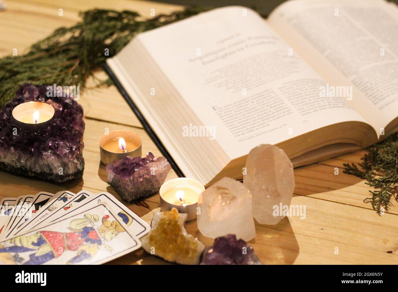 Tarot cards, candles and crystals with daylight. Concept of esoteric ...