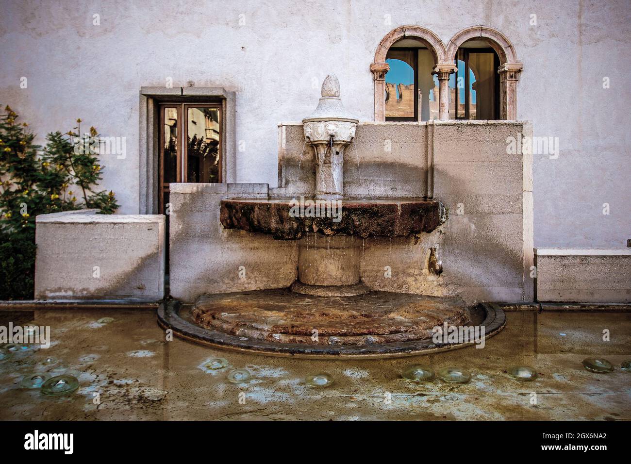 beautiful fountain in ancient castle, front view, Italy Stock Photo - Alamy