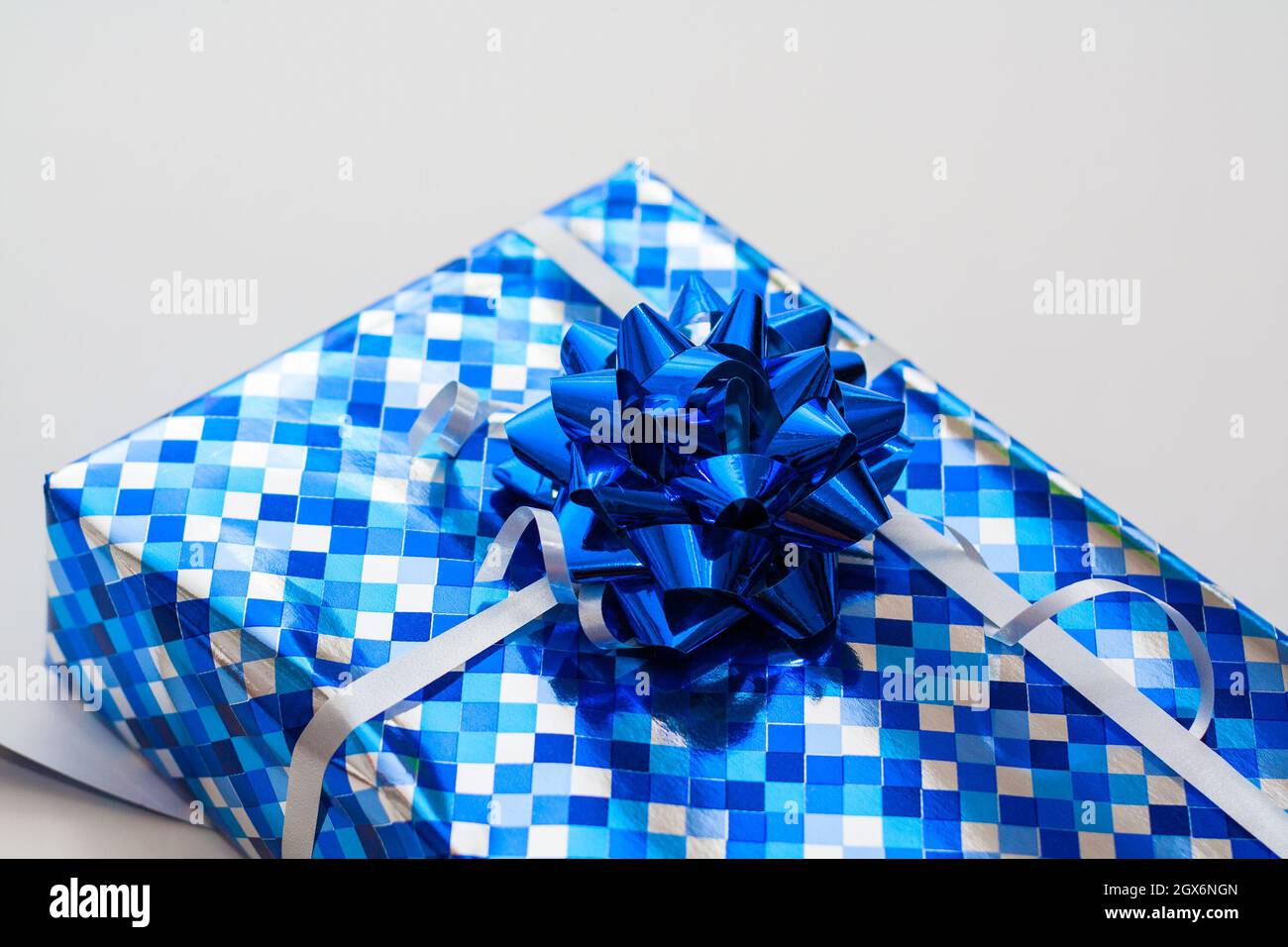 blue gift box with ribbon, gift wrapping Stock Photo - Alamy