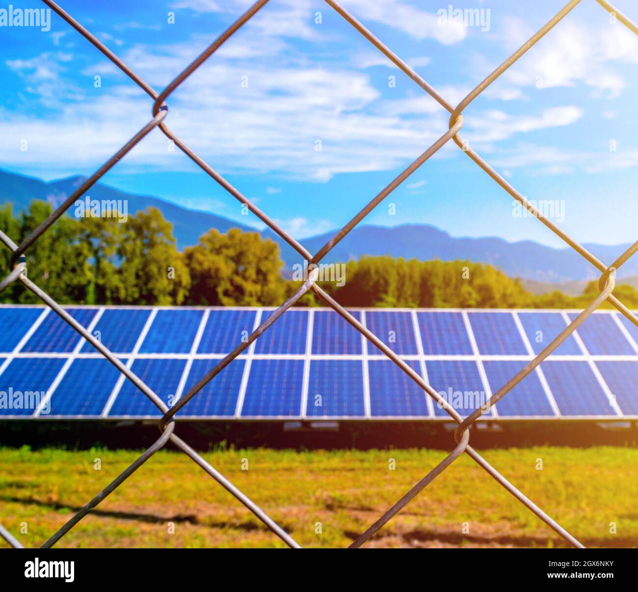 solar panels, fenced with metal fence mesh Stock Photo - Alamy