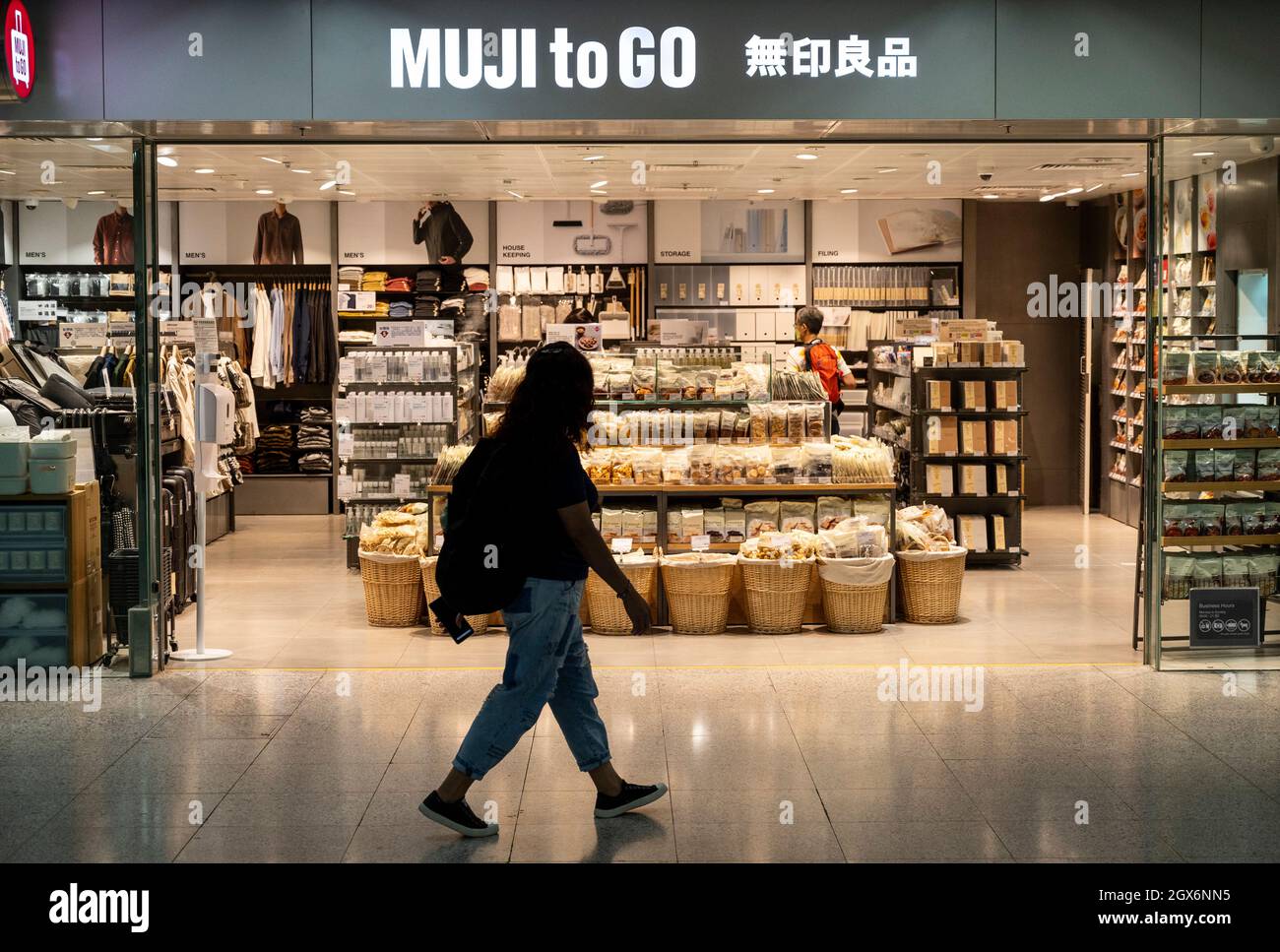 Hong Kong, China. 24th Sep, 2021. A woman walks past the Japanese ...