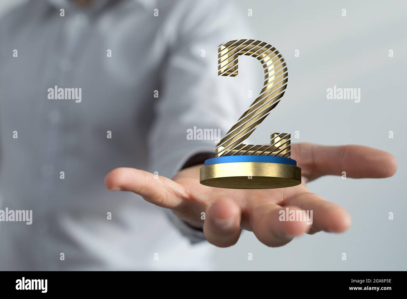 3D rendering of a number two trophy on a man's palm Stock Photo - Alamy