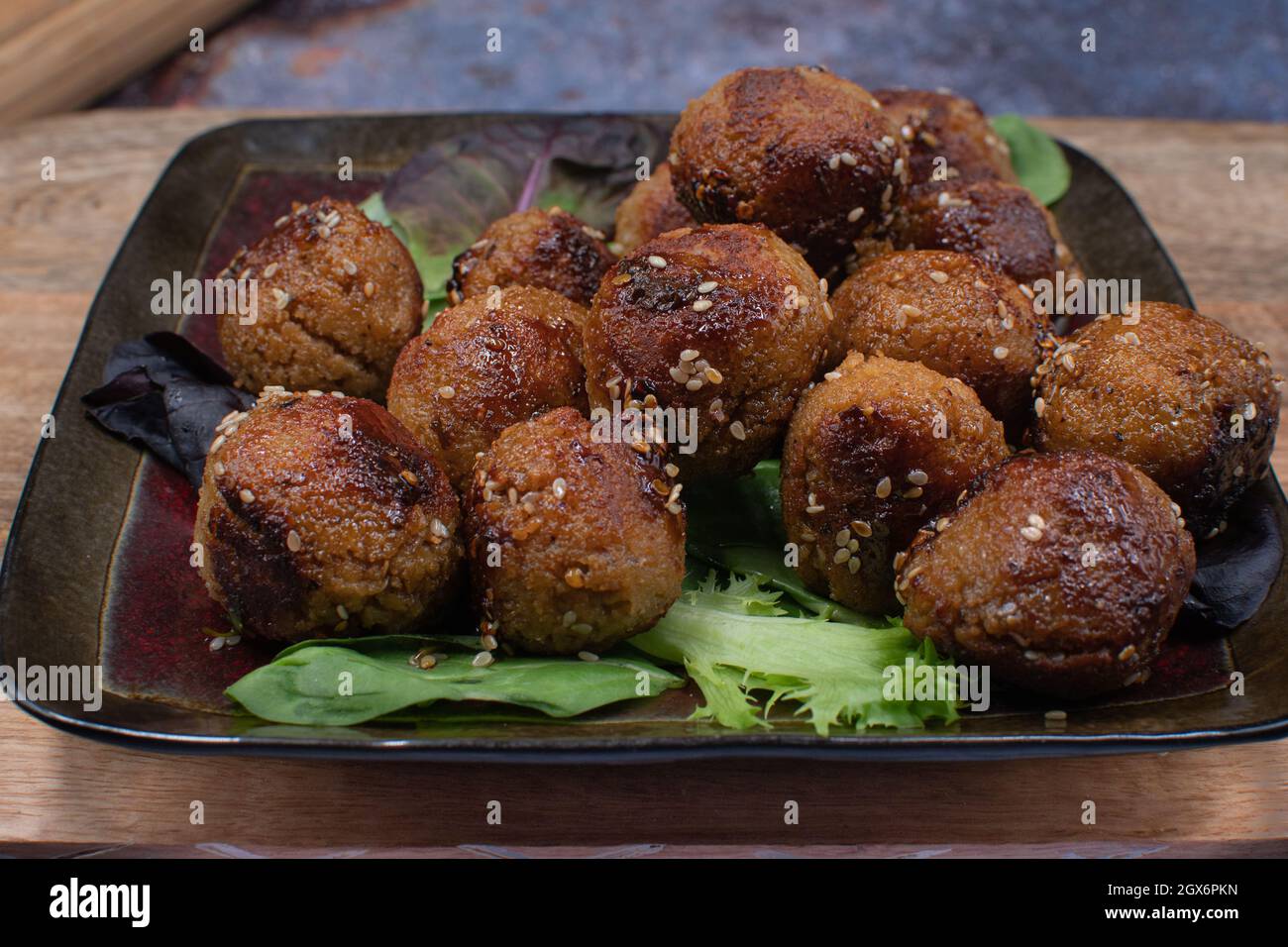 Seitan vegan meatballs tsukune style with tare sauce Stock Photo - Alamy