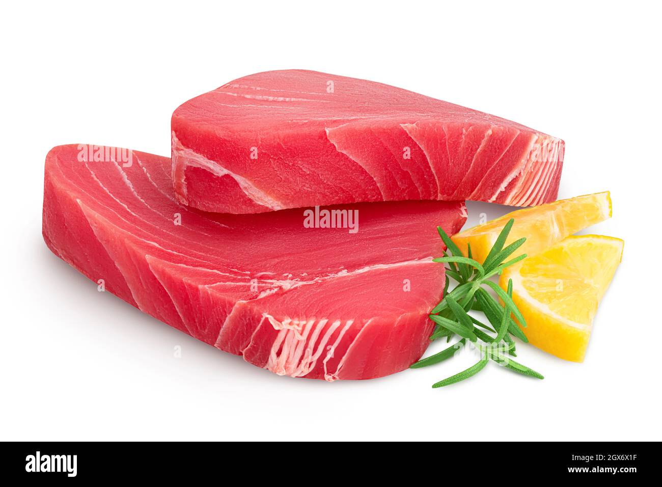 Fresh tuna fish fillet steak with rosemary and lemon isolated on white ...
