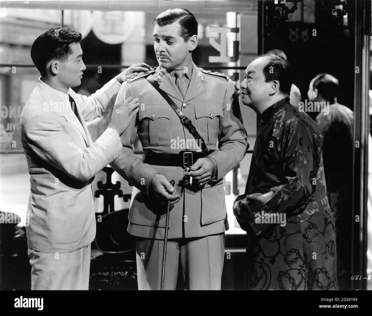 CLARK GABLE in Tailor Shop in THEY MET IN BOMBAY 1941 director CLARENCE ...